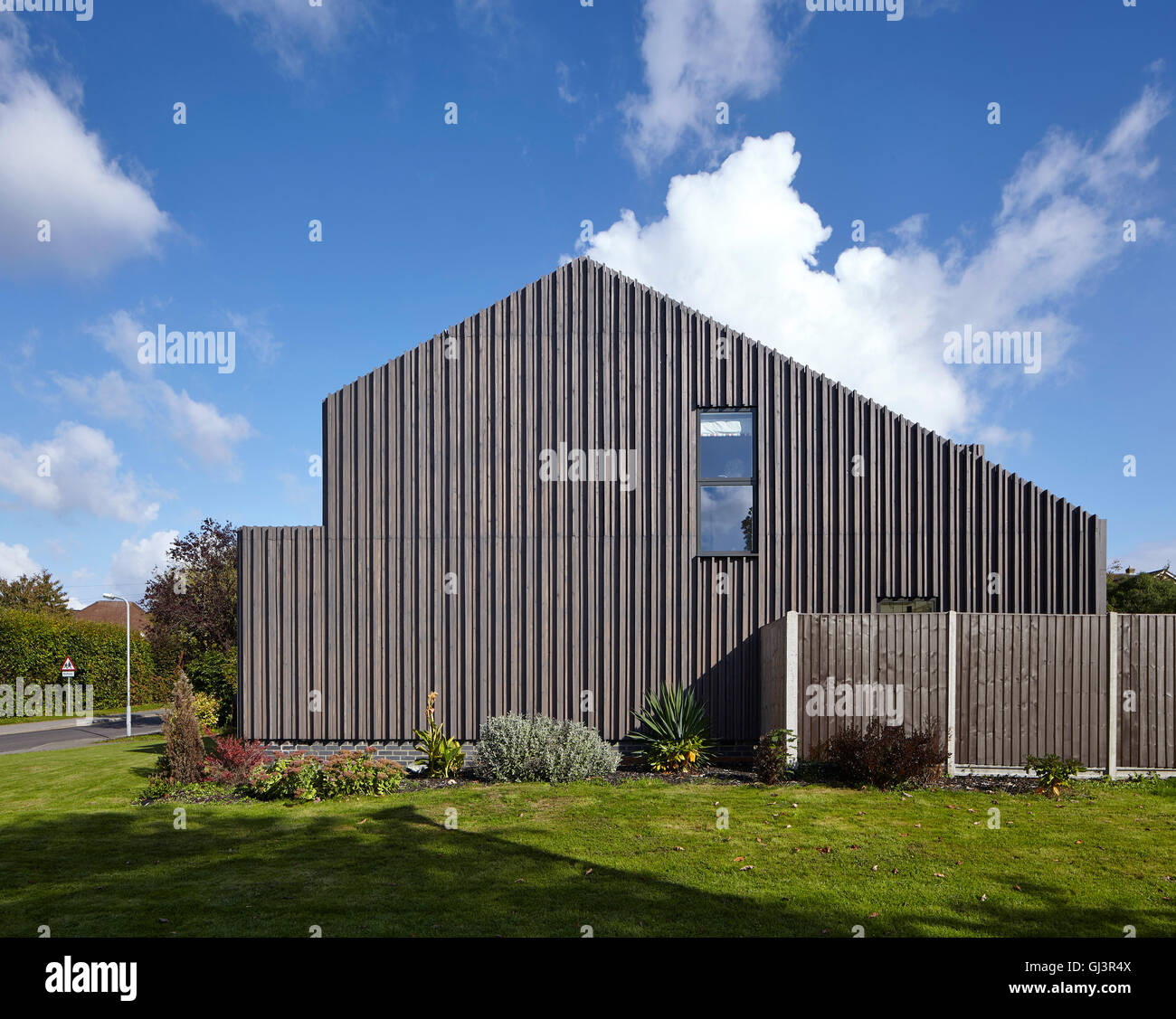 Side elevation showing dark timber cladding. Paired House, Beaconsfield ...