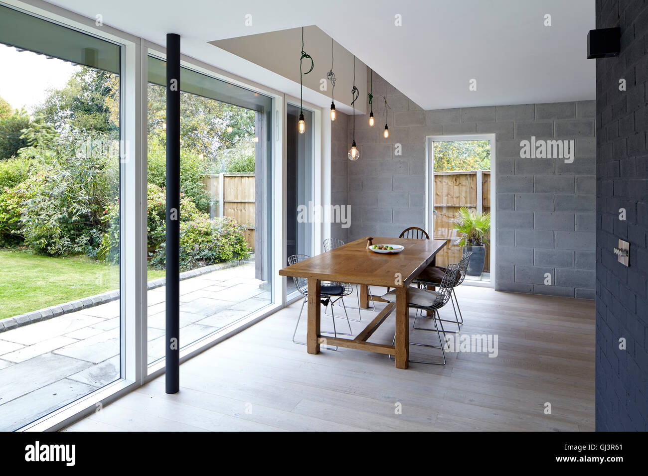 Kitchen and dining area naturally lit with large windows. Paired House ...