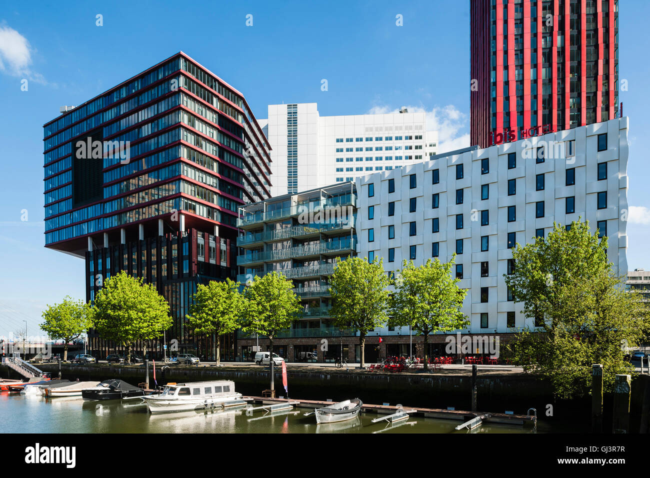 Over the canal elevation view of modular block and high-rise tower. The ...