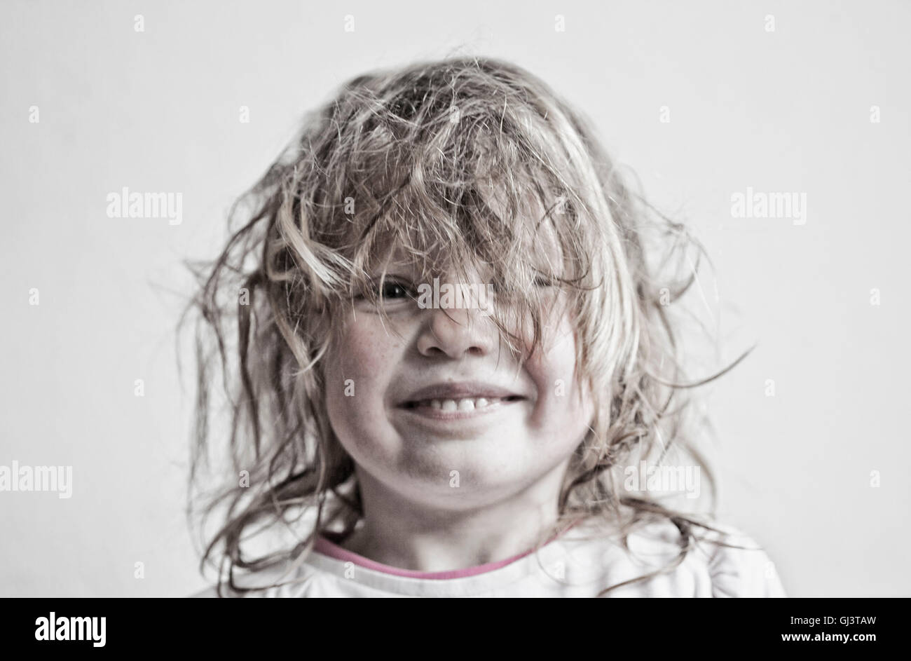 Girls with shaggy hair are smiling into camera Stock Photo - Alamy