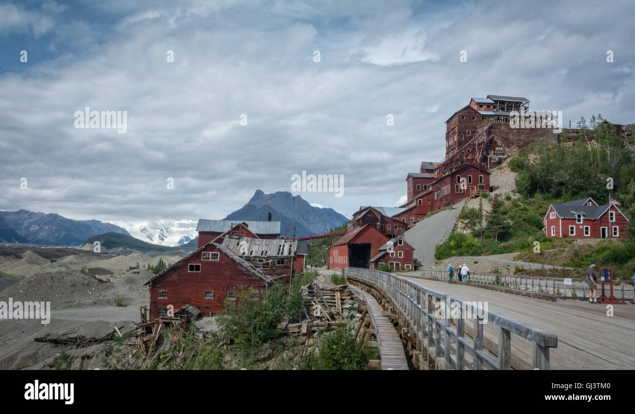 Tourists walk over bridge towards Kennicott mine Stock Photo - Alamy