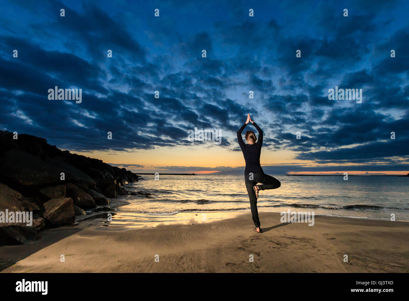 Summer sunset yoga session on beautiful Playa Fanabe beach - tropical ...
