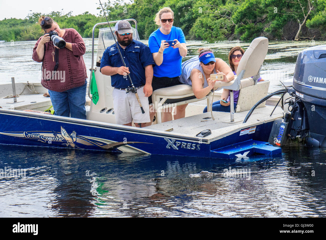 Boatload of visitors on Grosse Savanne Eco Tour trip photograph ...