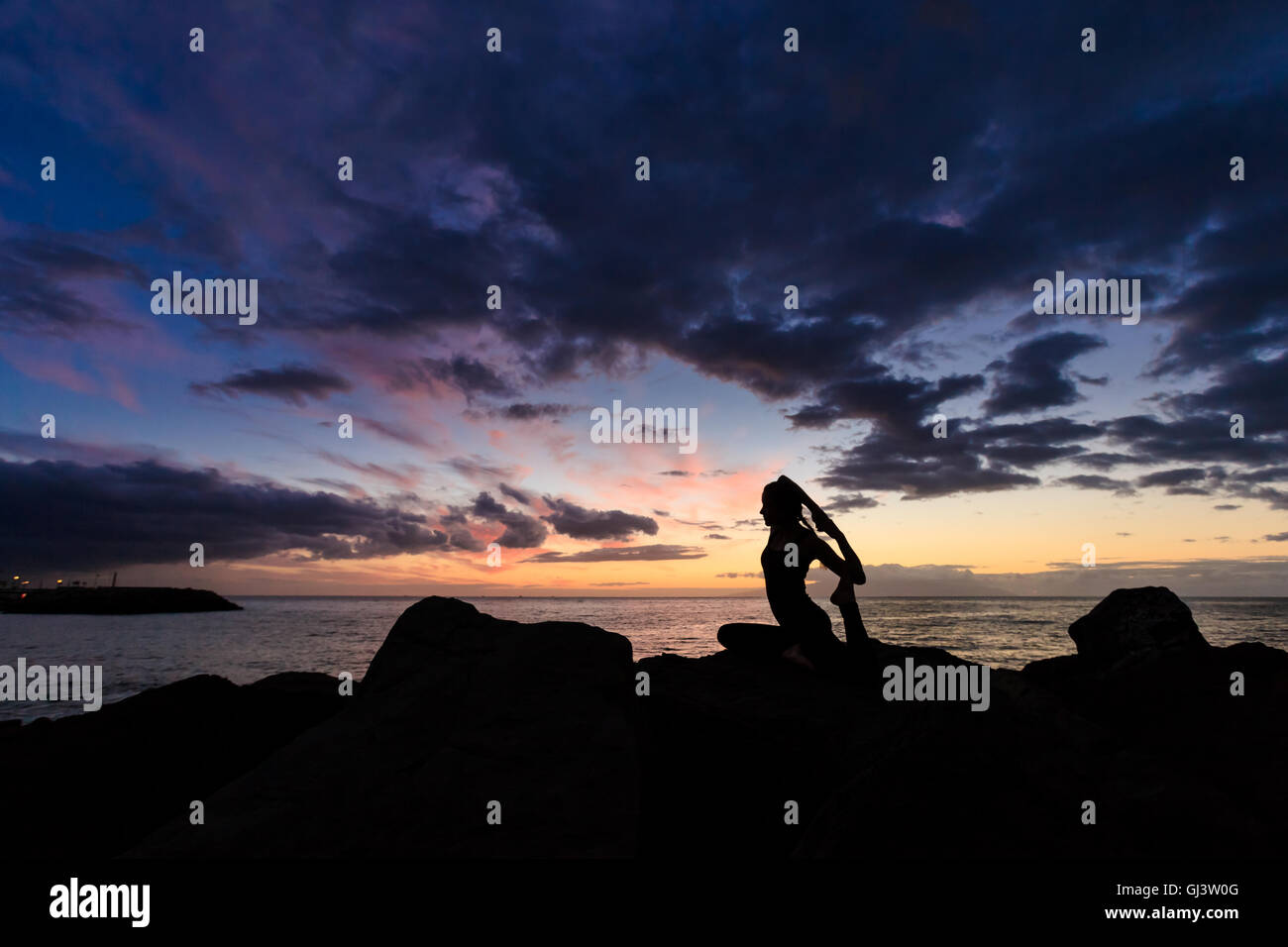 Summer sunset yoga session on beautiful Playa Fanabe beach - tropical ...