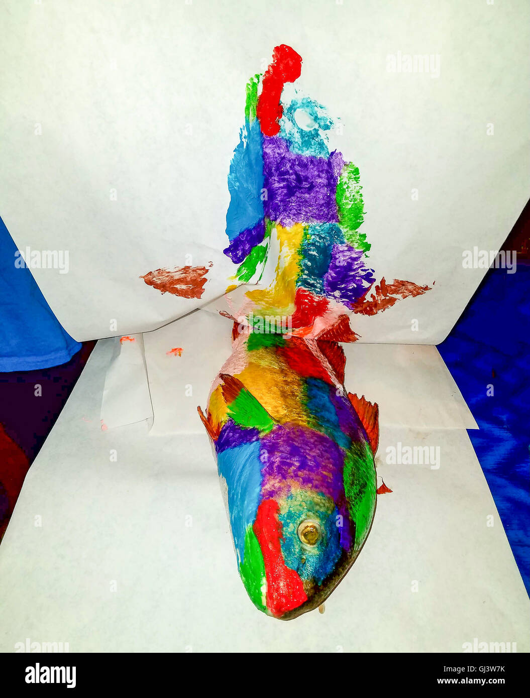 Painting (real) redfish to make a stenciled artwork on paper at Arts ...