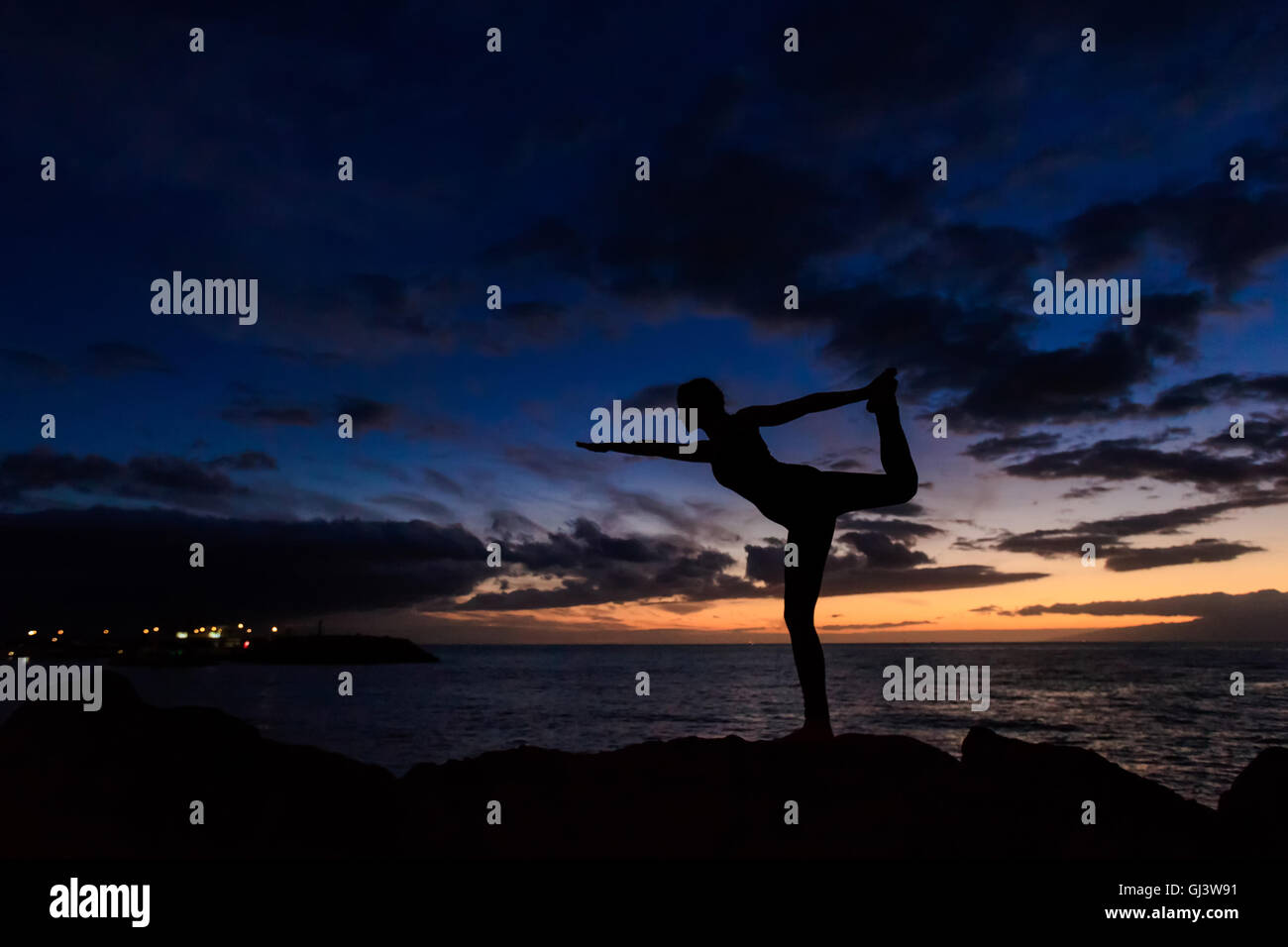 Summer sunset yoga session on beautiful Playa Fanabe beach - tropical ...