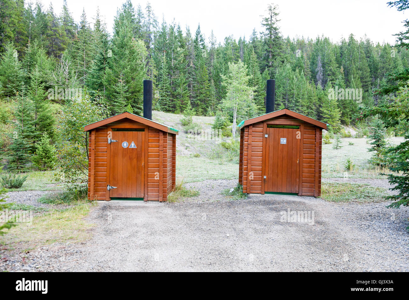Outside toilets or drop boxes in a forest clearing Jasper Alberta ...