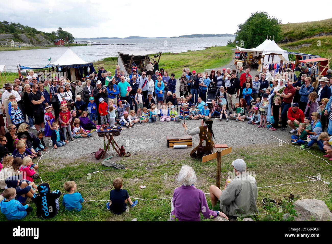 A juggler entertains audience while performing outdoors Stock Photo - Alamy