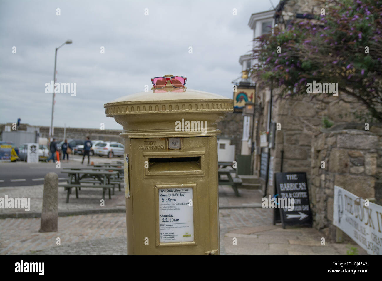 Penzance, Cornwall, UK. 12th August 2016. The golden postbox in ...