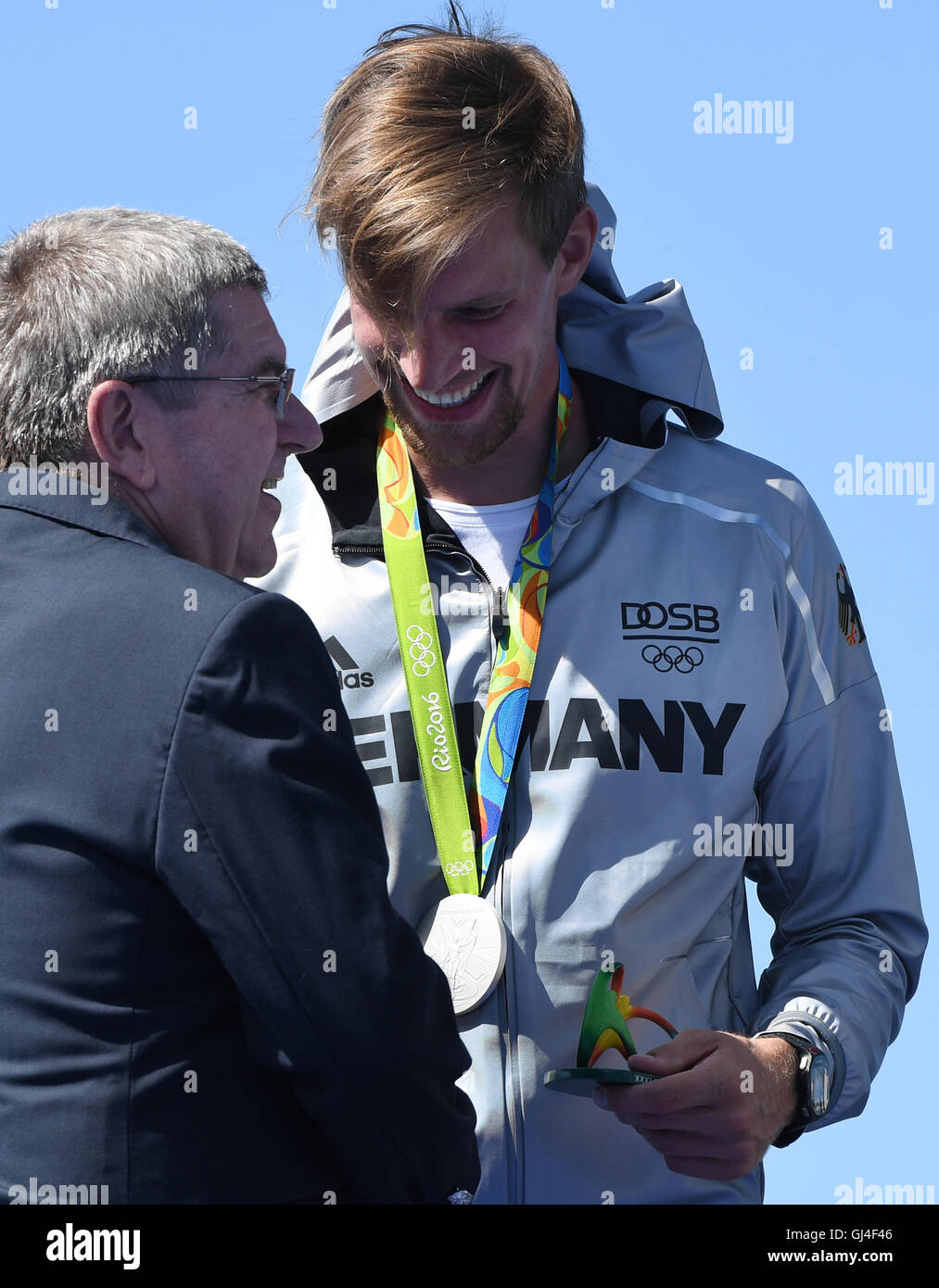 Rio de Janeiro, Brazil. 13th Aug, 2016. Maximilian Munski (R) of Germany is congratulated by IOC ...