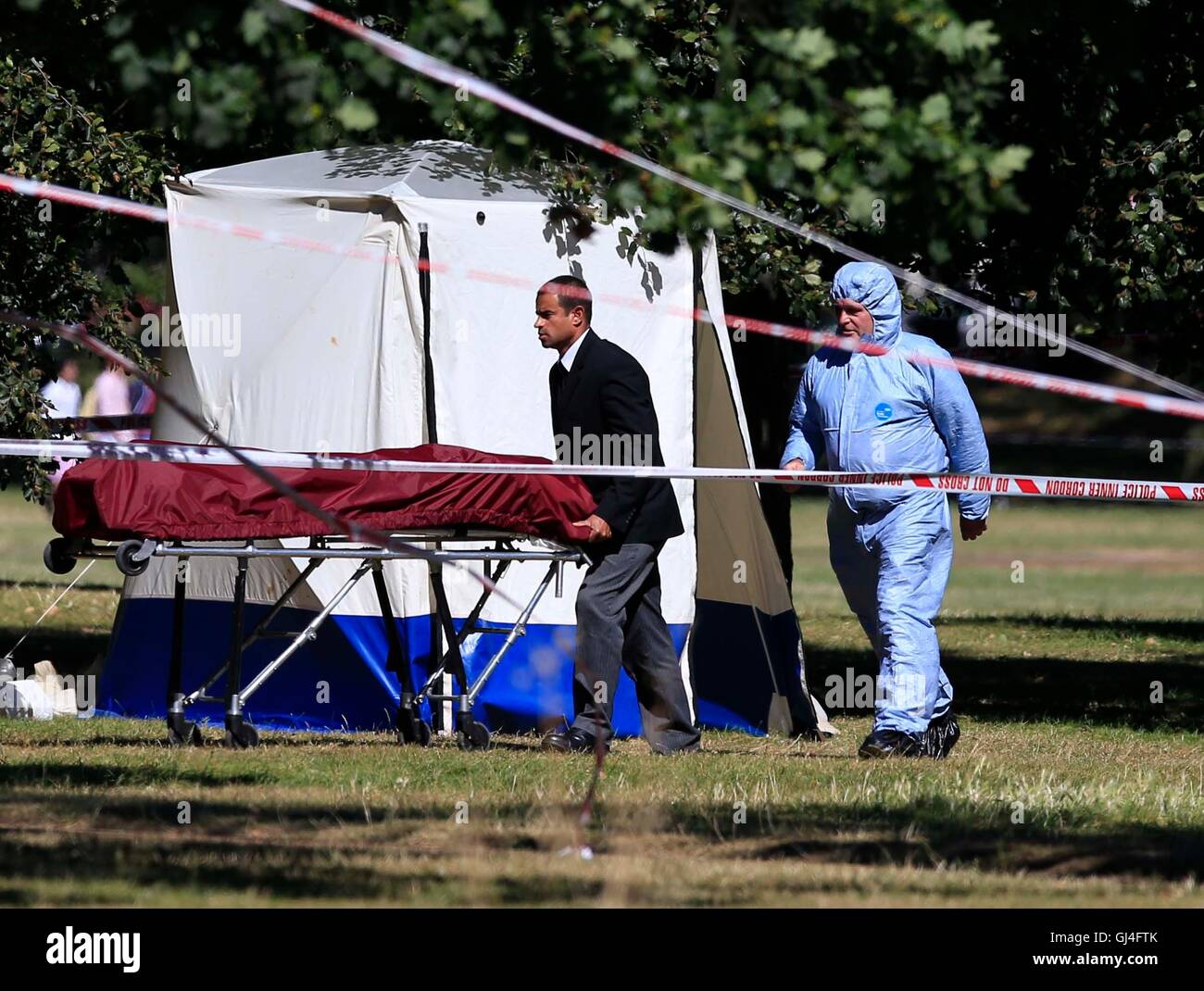 A body is removed from a police tent in Hyde Park, London, after a body ...