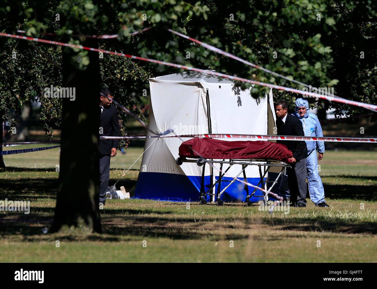 A body is removed from a police tent in Hyde Park, London, after a body ...