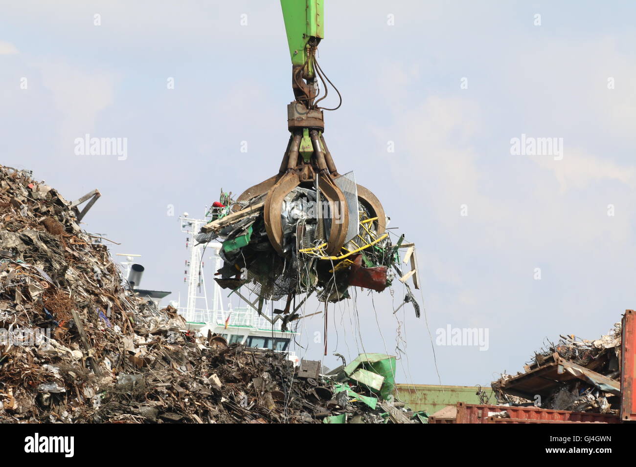 Crane with grab claw at scrap metal recycling yard, Hamburg Stock Photo ...