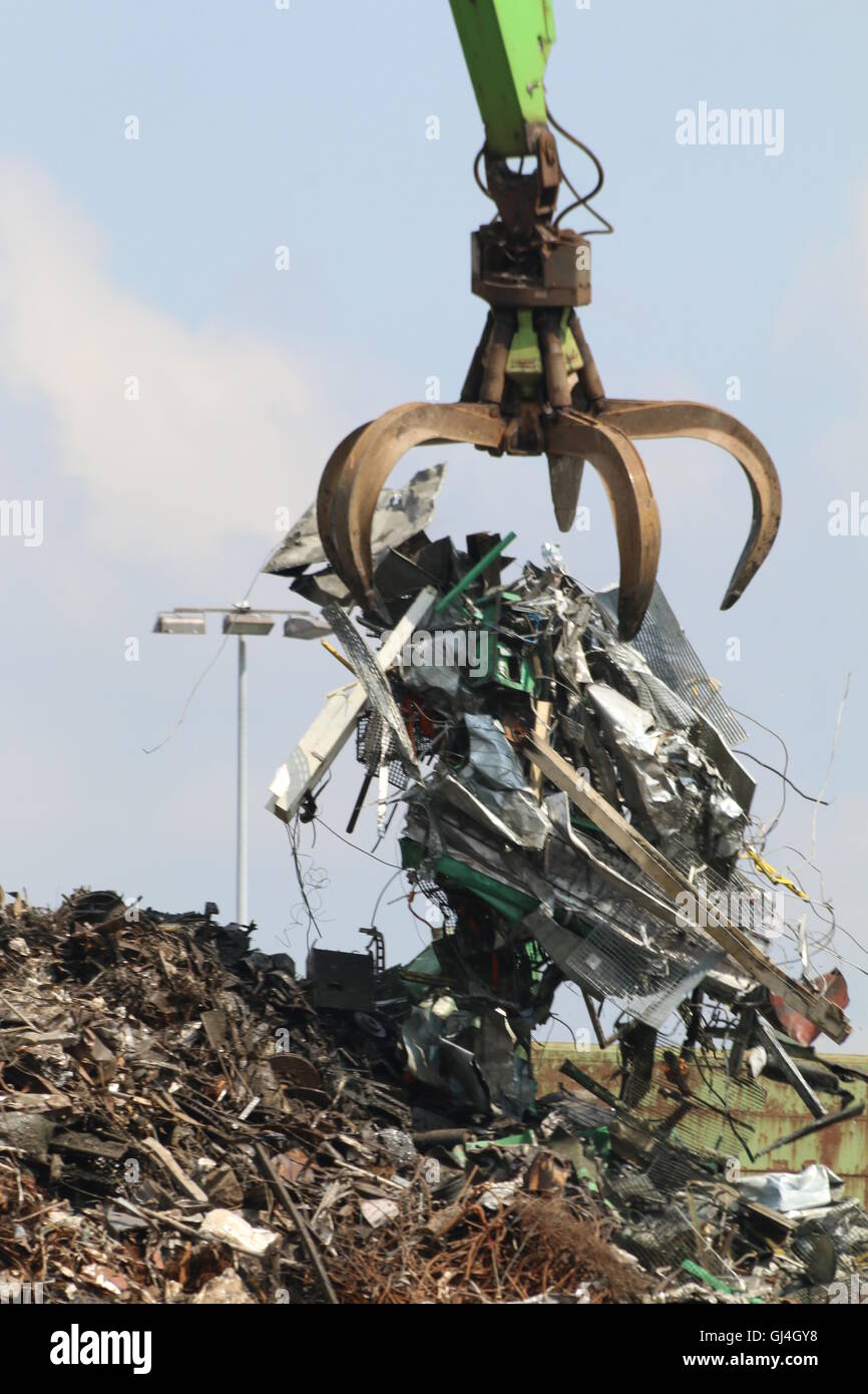 Crane with grab claw at scrap metal recycling yard, Hamburg Stock Photo ...