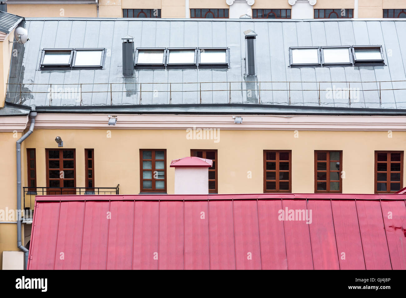 old building with skylights on new grey metal roof Stock Photo - Alamy