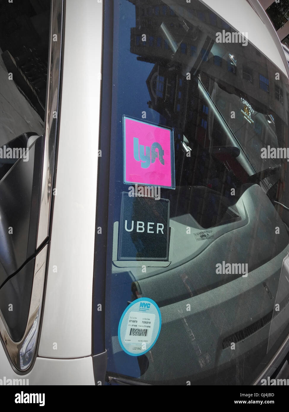 A livery with affiliation stickers for both competing Lyft and Uber in ...