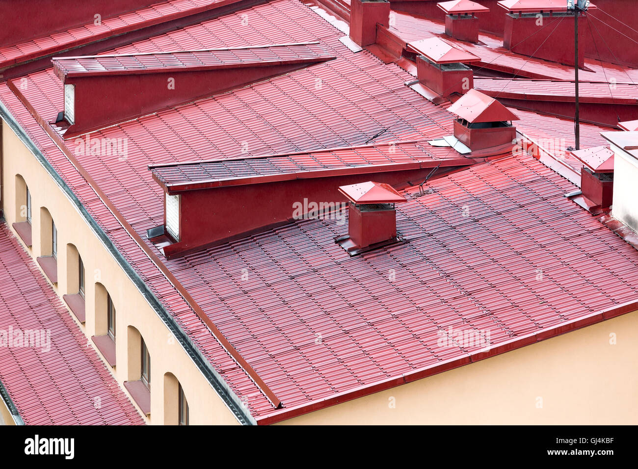 new red metal tiled roofs with dormer windows and chimneys Stock Photo ...
