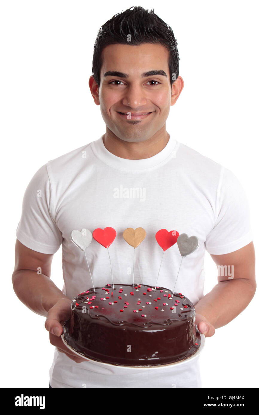 Man carrying romantic heart cake Stock Photo - Alamy