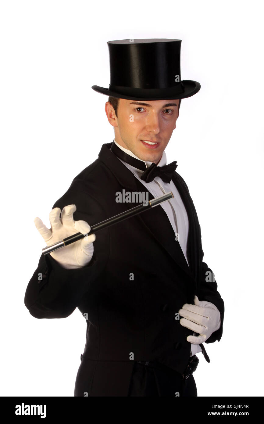 young magician performing with wand Stock Photo - Alamy
