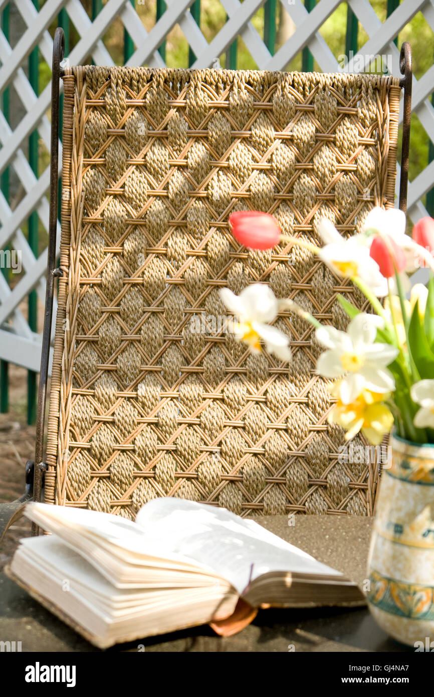 book and flowers on a table Stock Photo - Alamy