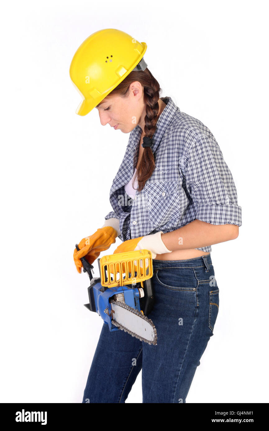 Beauty woman with chainsaw Stock Photo - Alamy