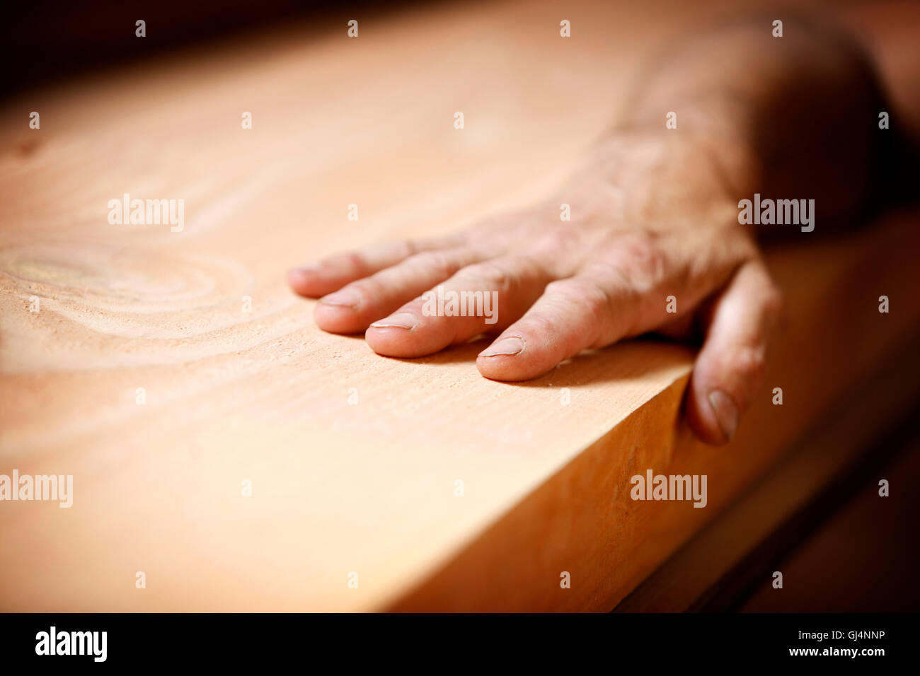 Hand on wood Stock Photo - Alamy