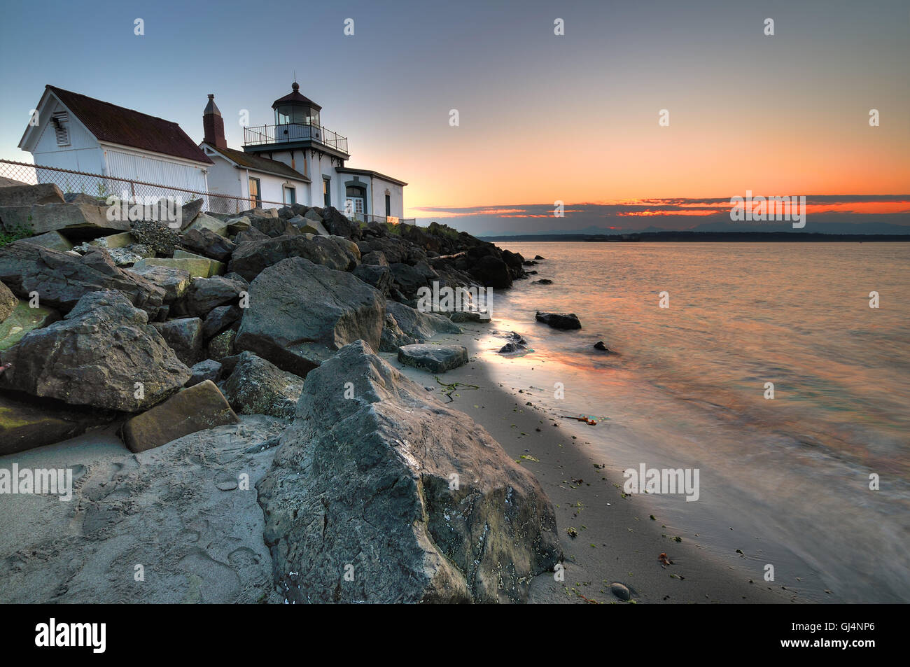 Lighthouse at dusk Stock Photo - Alamy