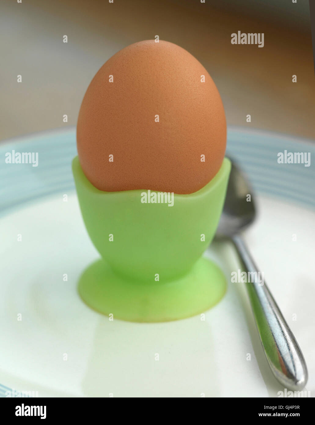 hens egg with spoon on the plate Stock Photo - Alamy