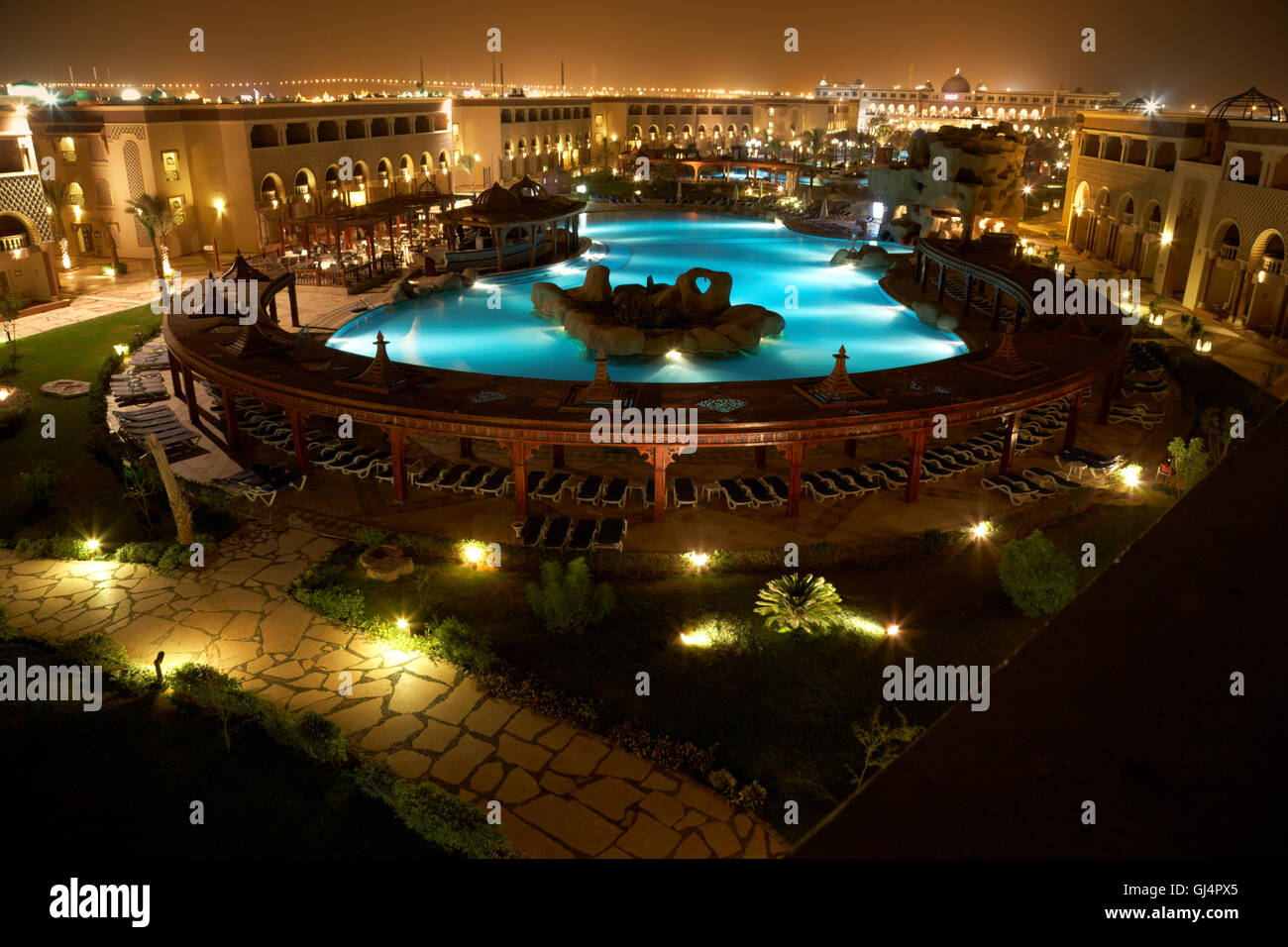 resort pool at evening Stock Photo - Alamy