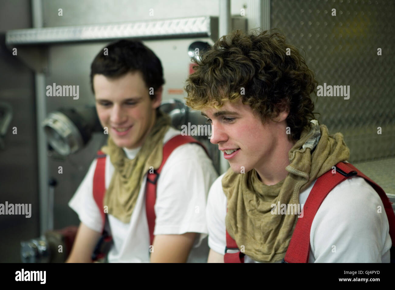 Two young Firemen Stock Photo - Alamy