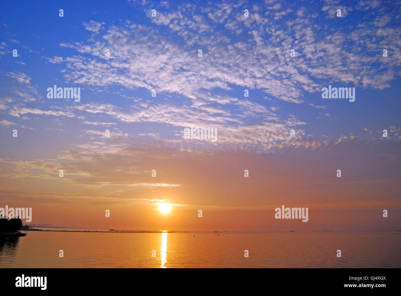 Sunset over Ocean Stock Photo - Alamy