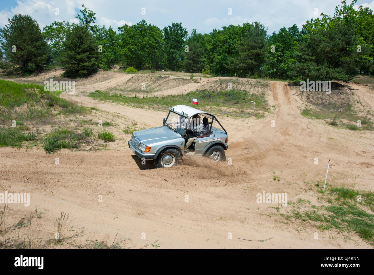 Off-road vehicles on display and in action during a summer public event ...