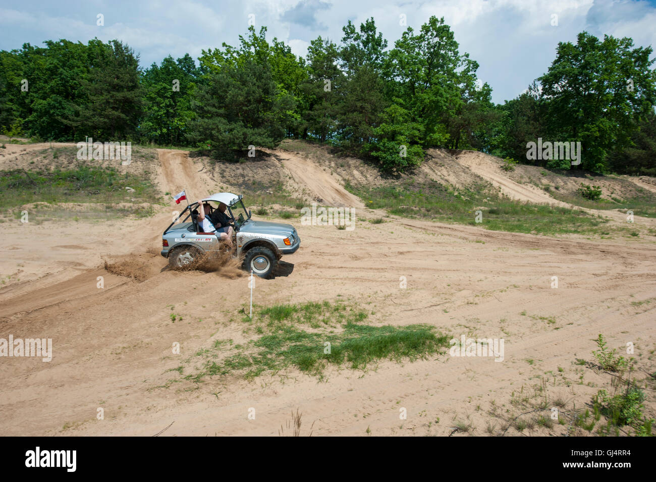 Off-road vehicles on display and in action during a summer public event ...
