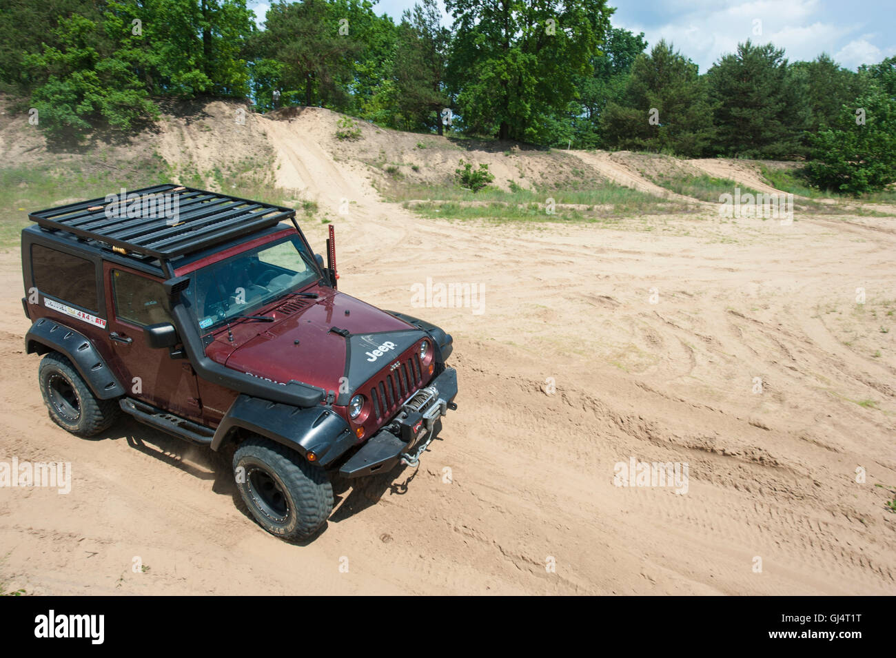 Off-road vehicles on display and in action during a summer public event ...
