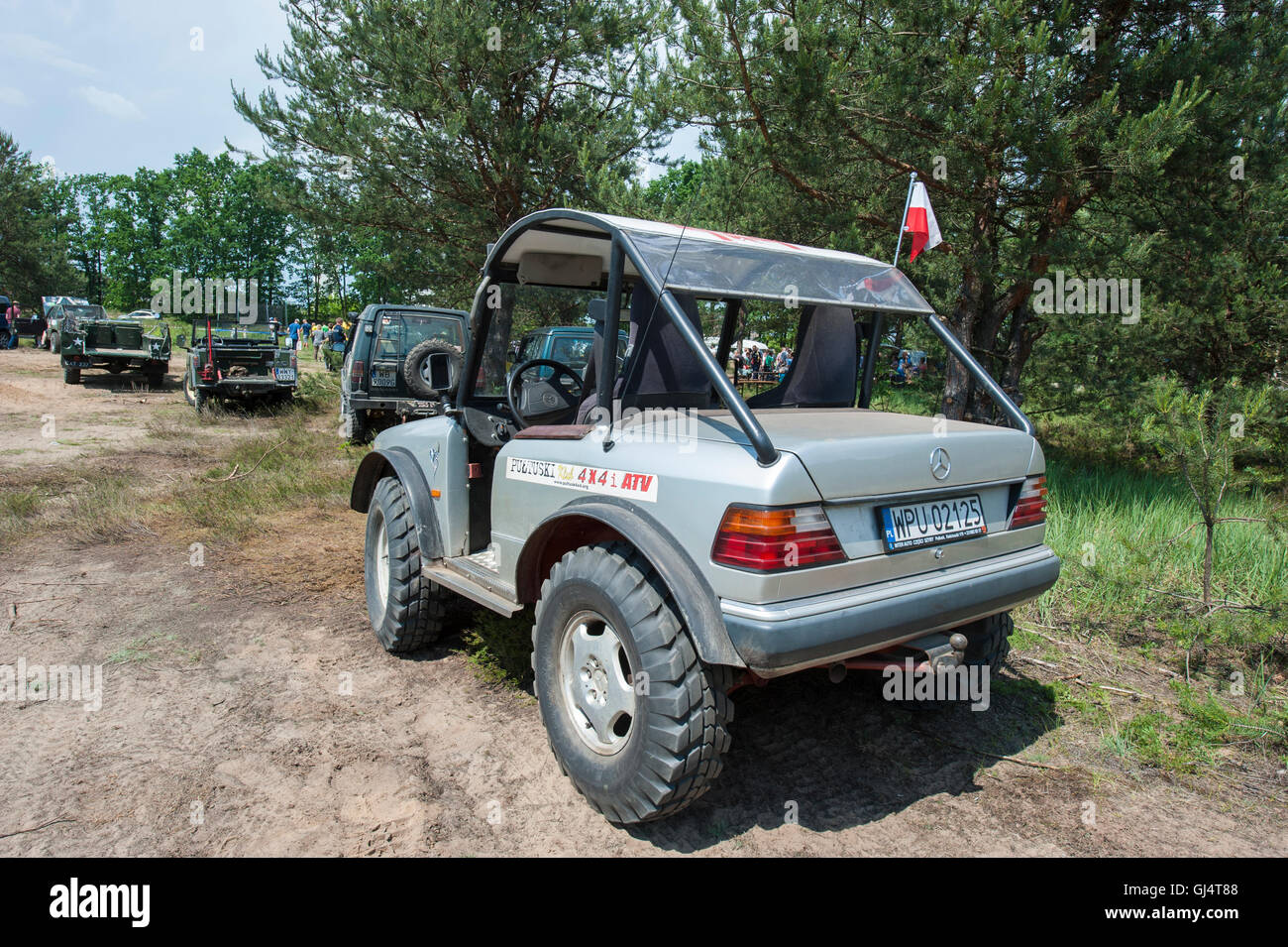 Off-road vehicles on display and in action during a summer public event ...