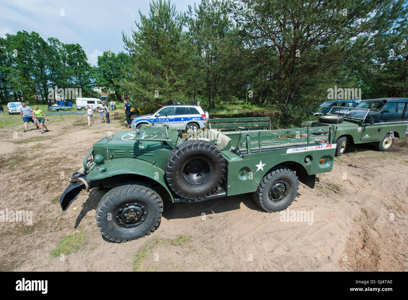 Off-road vehicles on display and in action during a summer public event ...