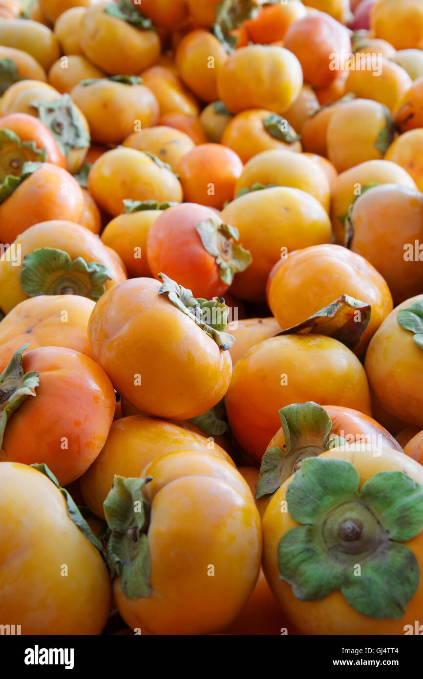 Pile of persimmons hi-res stock photography and images - Alamy