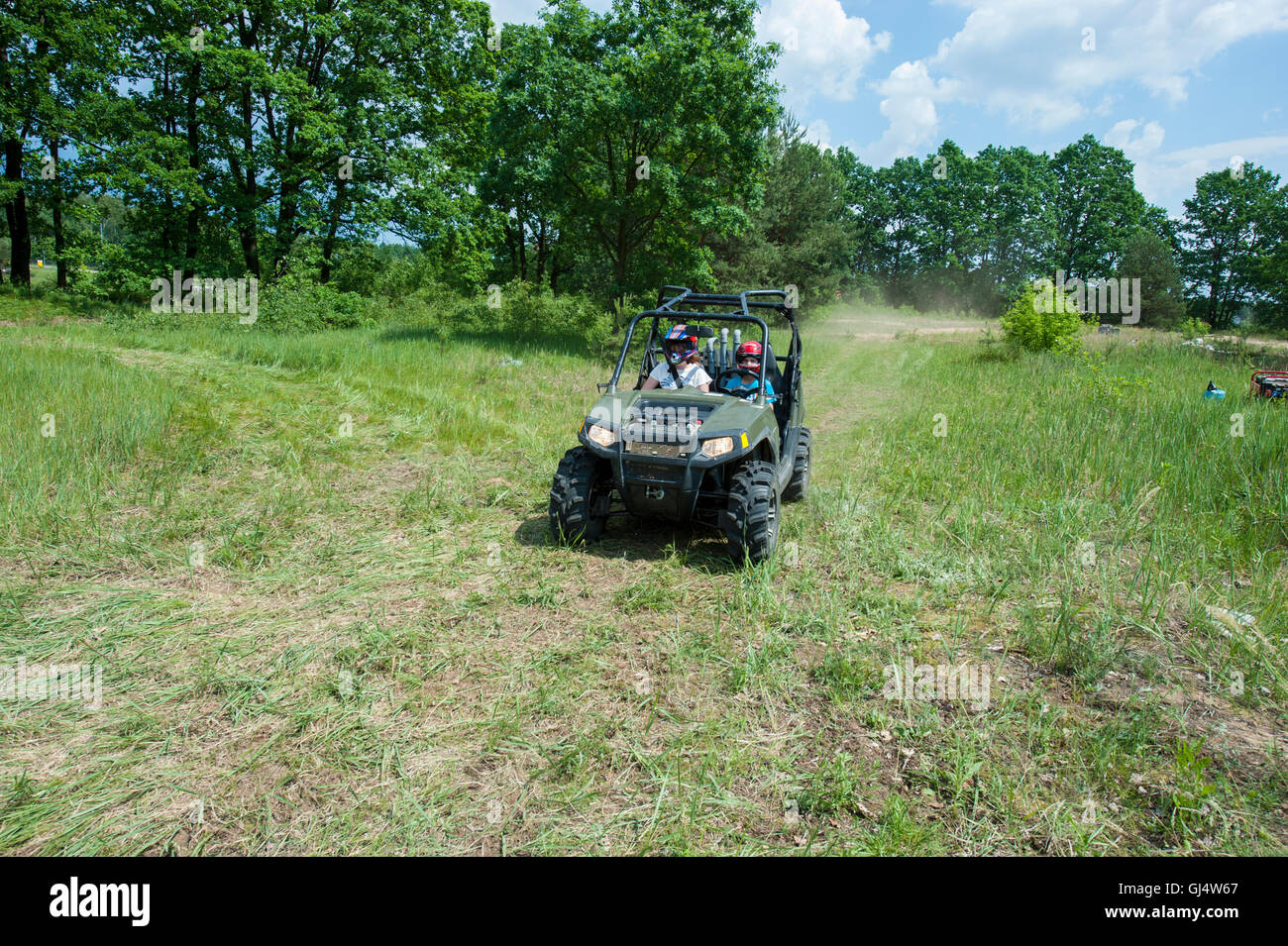 Off-road vehicles on display and in action during a summer public event ...