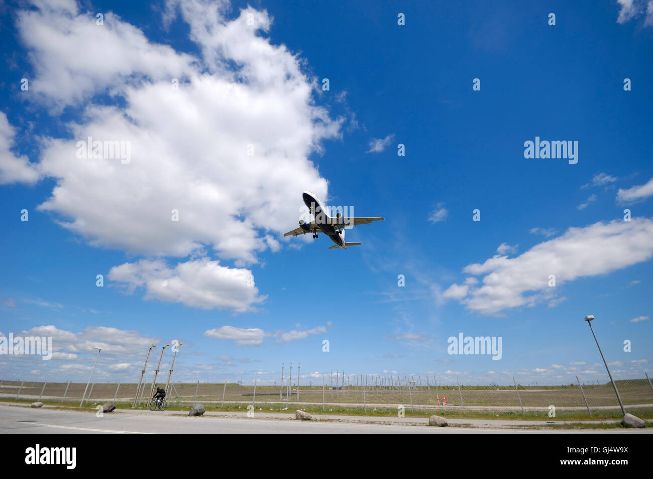 Low plane near airport Stock Photo - Alamy