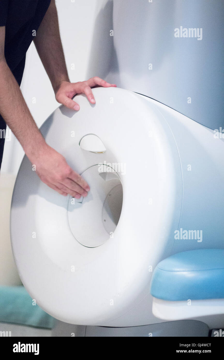 Magnetic resonance imaging totally open MRI scanner and technician in ...