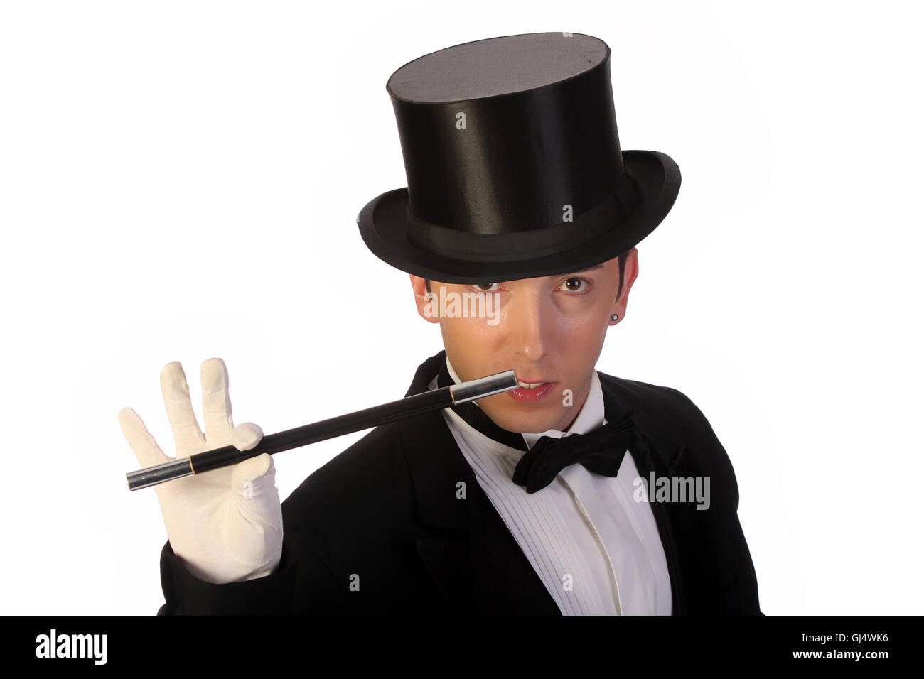 young magician performing with wand Stock Photo - Alamy