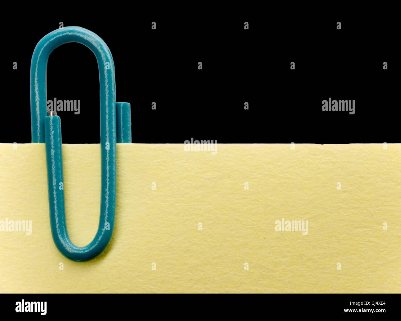 Paperclip on a note Stock Photo - Alamy