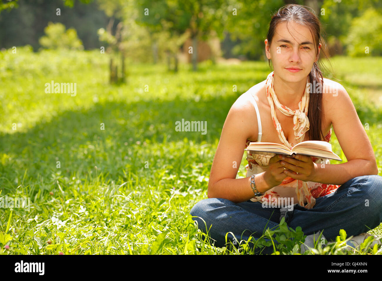 Woman reading a book Stock Photo - Alamy