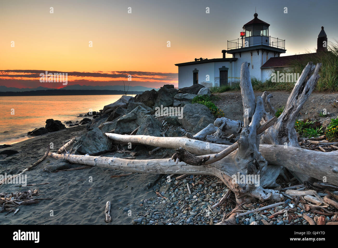 Lighthouse at dusk Stock Photo - Alamy