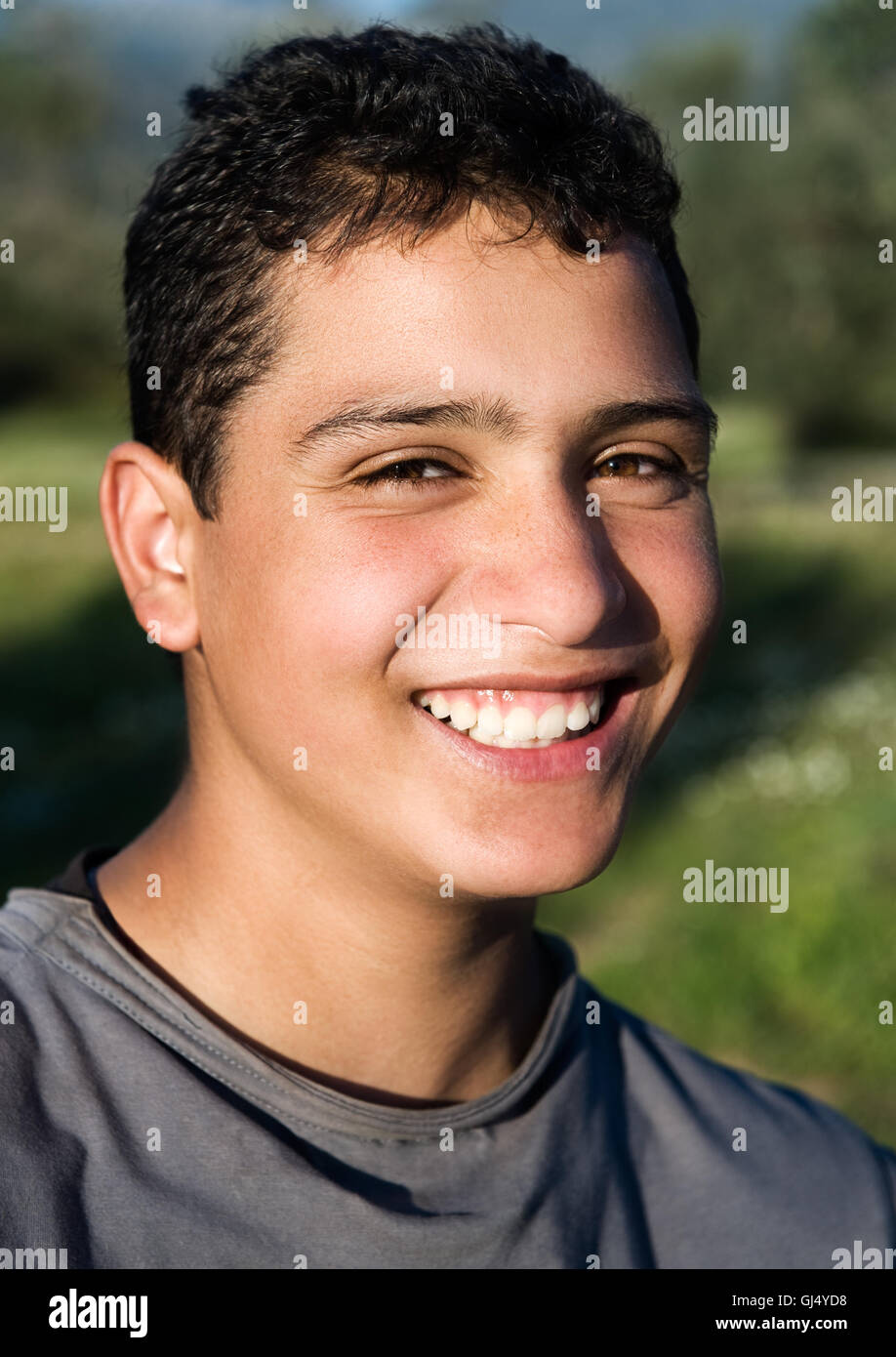 Young guy smiling Stock Photo - Alamy