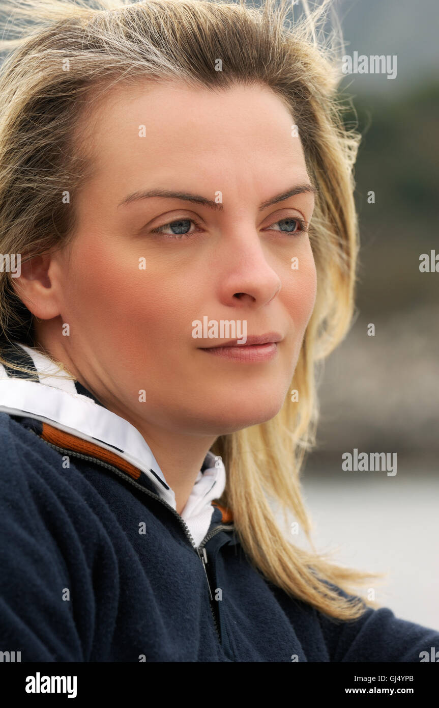 Beautiful young woman looking away Stock Photo - Alamy