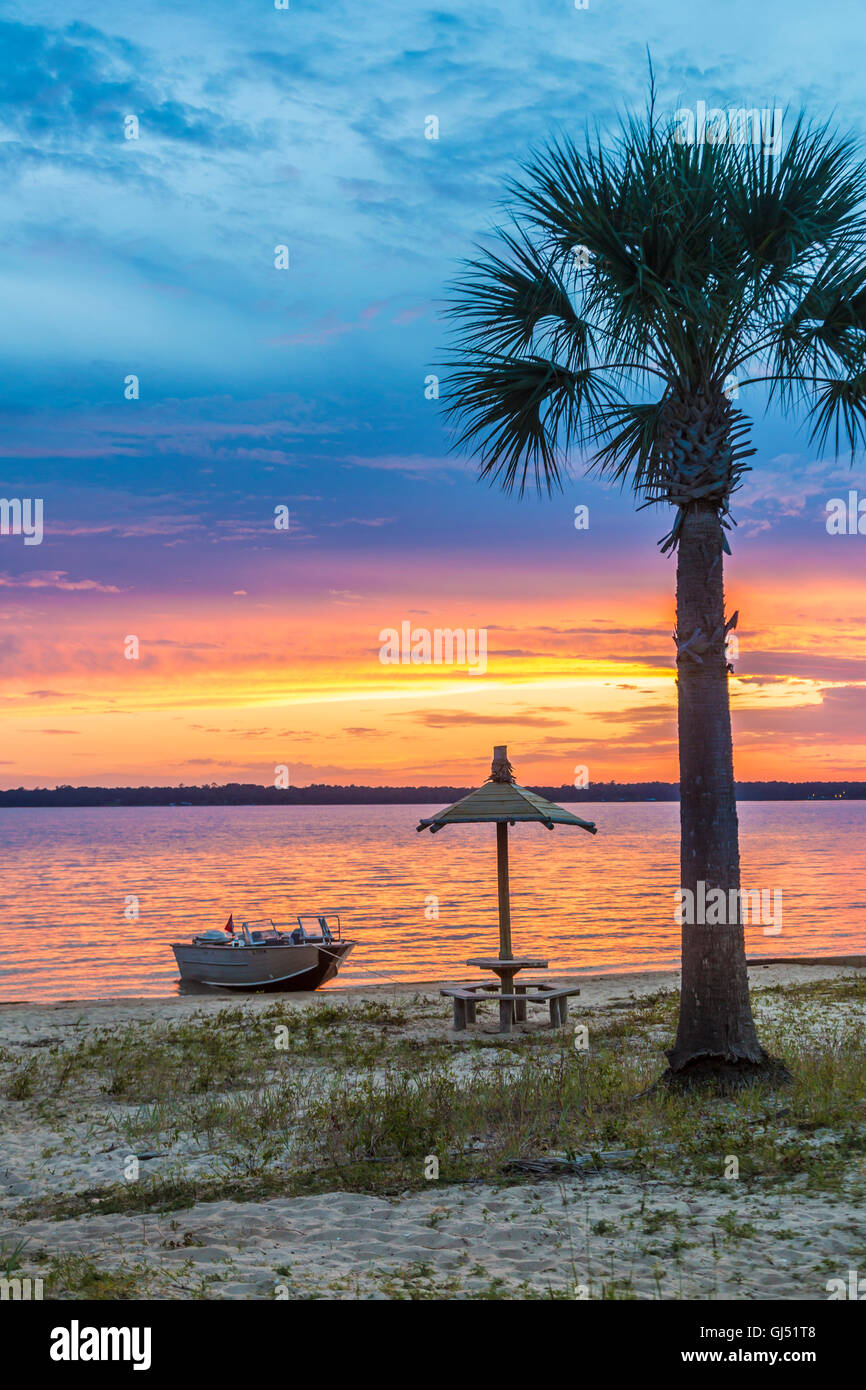 Aluminum fishing boat beached in Perdido Bay at sunset Stock Photo - Alamy