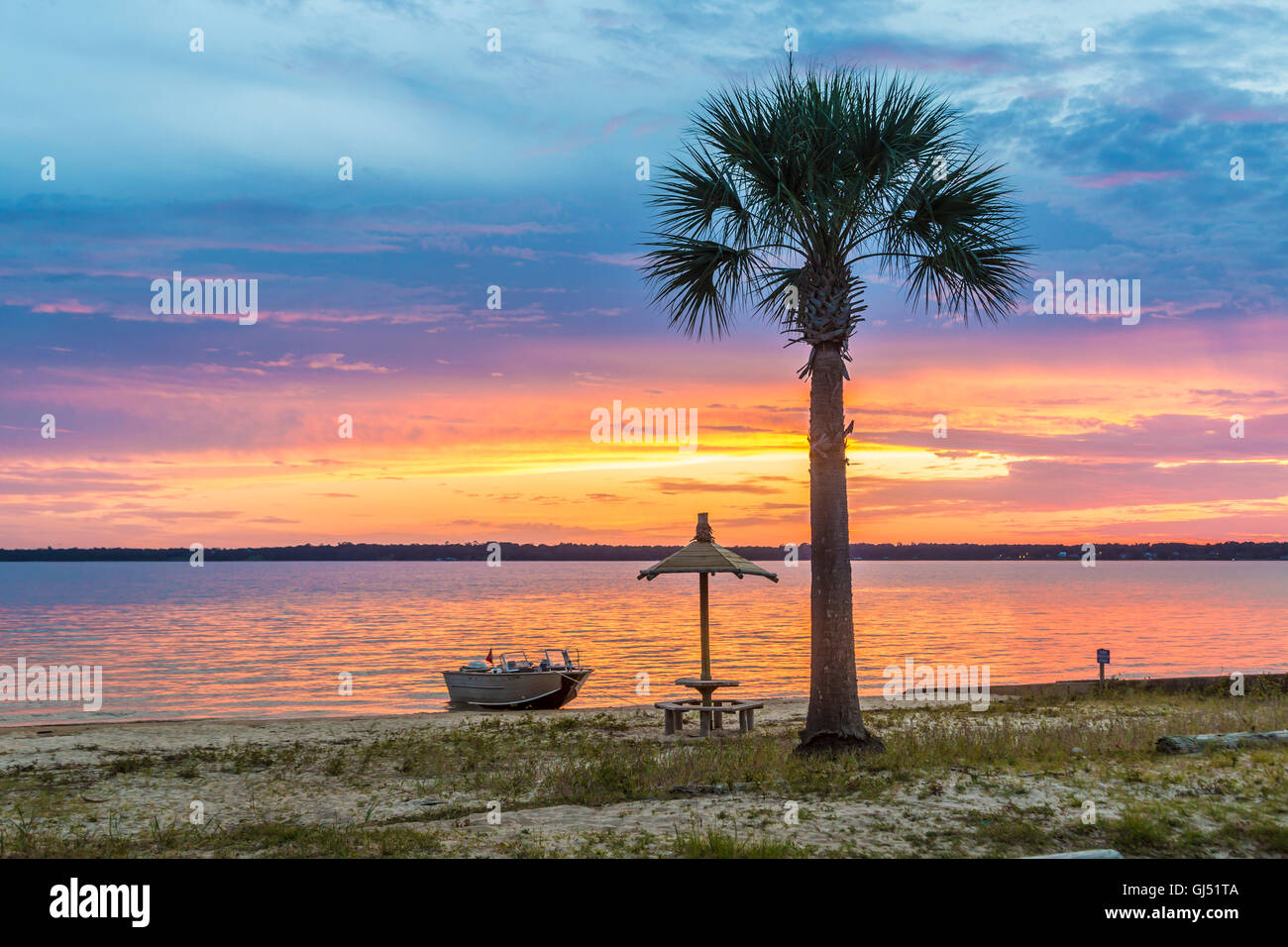 Aluminum fishing boat beached in Perdido Bay at sunset Stock Photo - Alamy