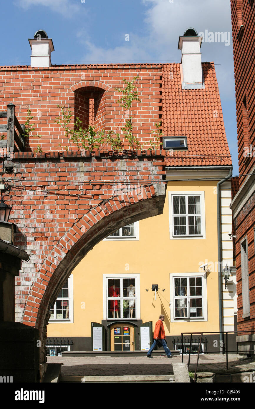 City wall and Torna iela street (Tower Street) in the Old Town, in the ...