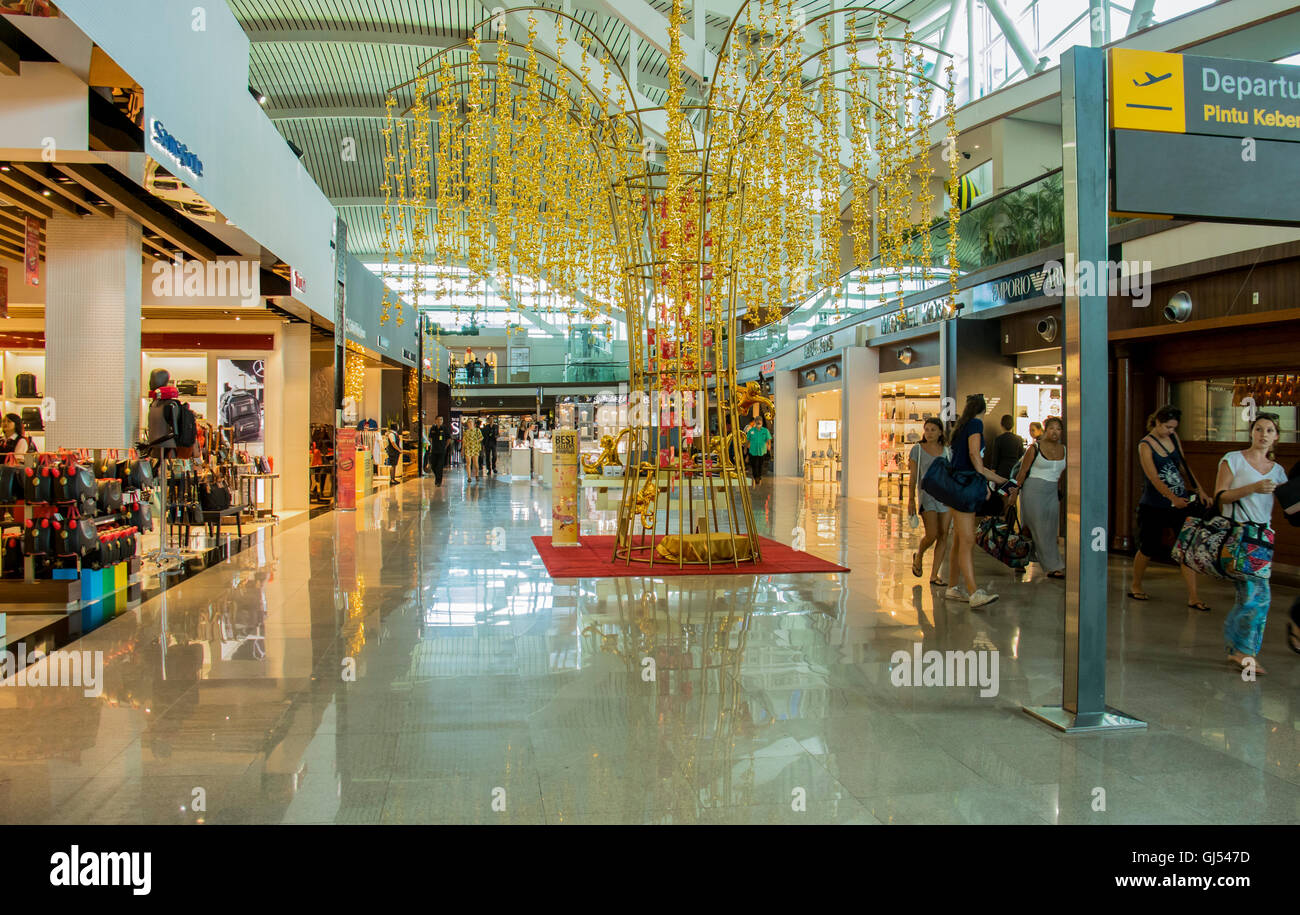 Inside Bali's international airport with people using various café's ...